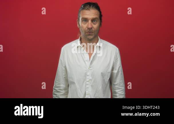 Man with long blond hair, wide eyes and mouth open in surprised ...