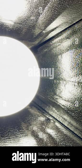 abstract metallic light tunnel with reflective silver foil texture ...
