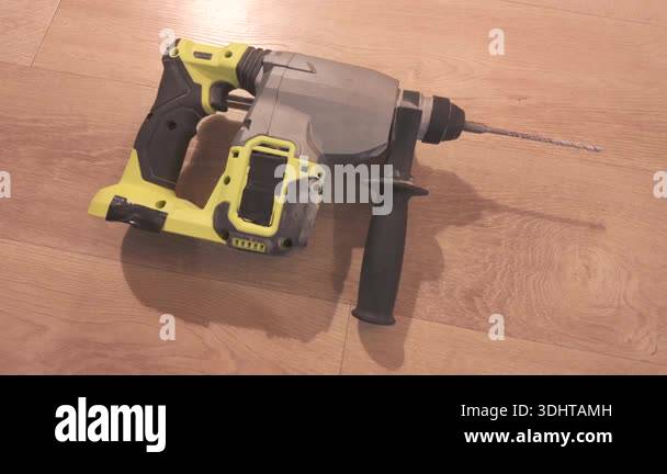 Cordless power tool in still scene lying on ground showing right side ...
