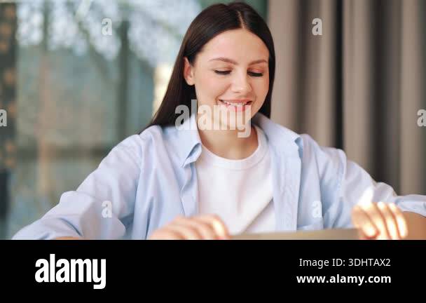 Woman smiles, closes eyes, stretching arms behind head. Contentment ...