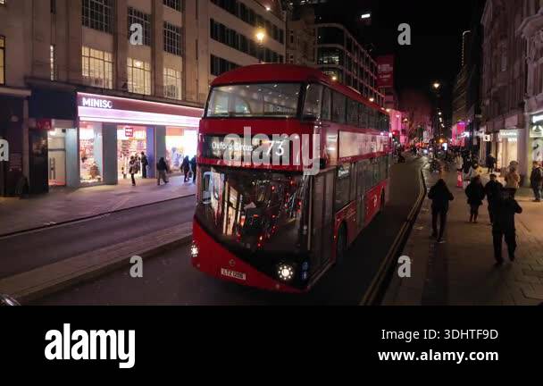 LONDON, UK - JANUARY 8, 2026 - Red double decker bus driving on Oxford ...