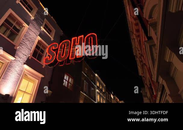 LONDON, UK - JANUARY 8, 2026 - Soho neon sign illuminating a night ...