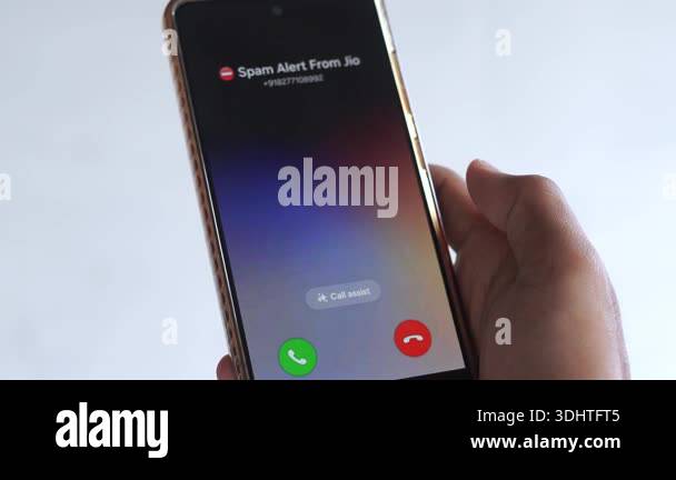 Holding smartphone displaying incoming anonymous call with question ...