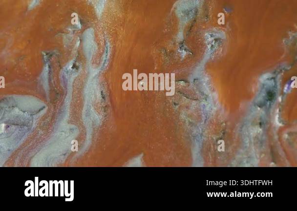 Paint drip. Mix color. Defocused orange bronze silver bright texture ...