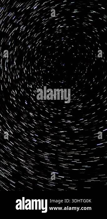 Time lapse of Star trails in the night sky. Stars move around a polar ...
