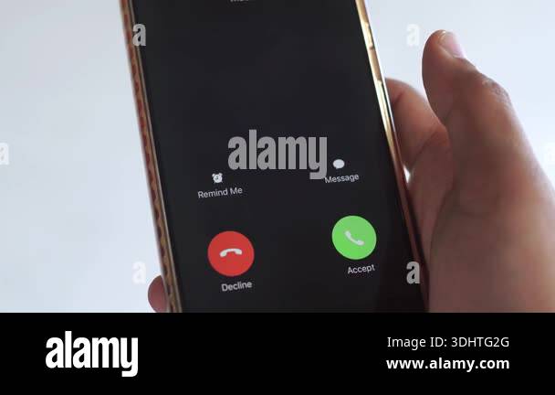 Holding smartphone displaying incoming anonymous call with question ...
