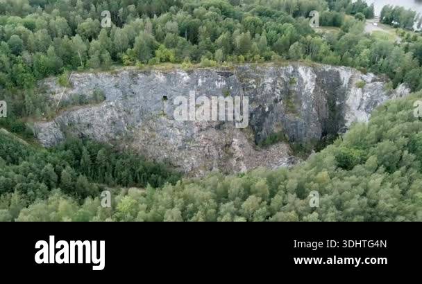 Aerial view of old Torma open pit mine in cloudy summer weather, Lohja ...