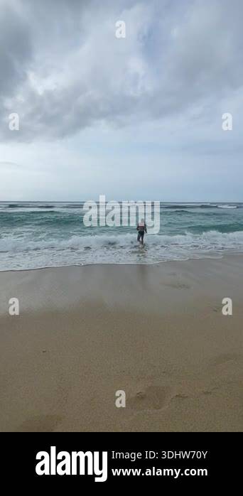 Stormy Clouds Over Wading Person And Surf, Restless Waves Breaking On ...