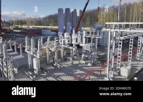 Electrical substation shows resistors and distributors placed outdoors ...