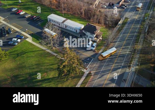 Wilson, NY, USA, 20 October 2025: Aerial view of yellow school buses ...