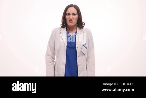 Angry woman doctor in blue uniform raises hands with stethoscope ...
