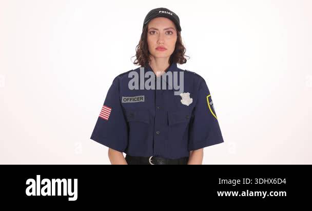 Police woman in dark uniform wears handcuffs on own wrists. Arrested ...