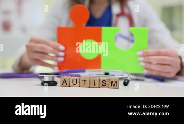 Text Autism on wood blocks near stethoscope against woman doctor ...