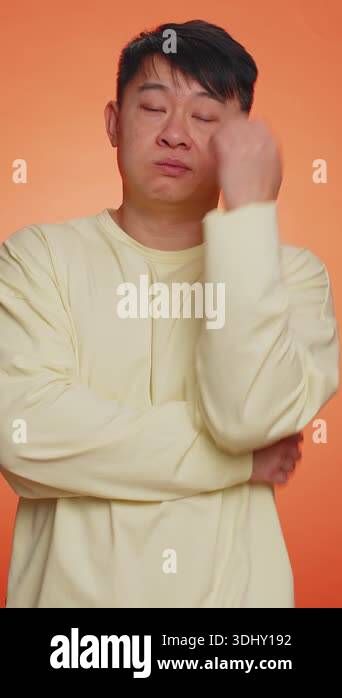 Sad Asian man tired bored indifferent expression, exhausted of tedious ...