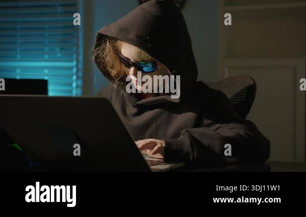 Office hacker kid typing malware at night. Digital hackers child attack ...