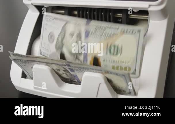 Cash counting process with hundred dollar notes. Banking operation and ...