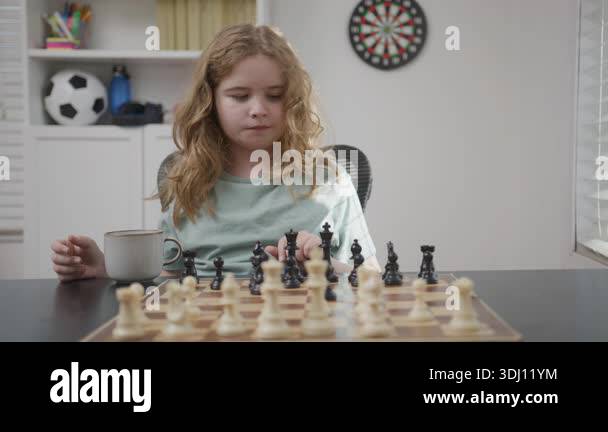 Kid playing chess at home. Child concentrating on chess move. Kid ...