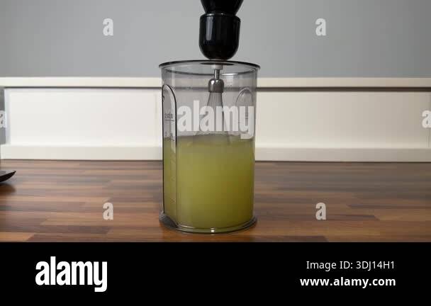 Close up video of raw eggs being beaten with a whisk. Concept of ...