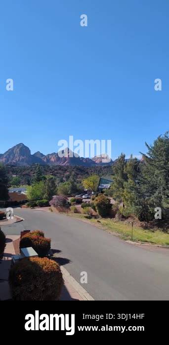 This vertical slow pan shot captures a scenic residential area in ...