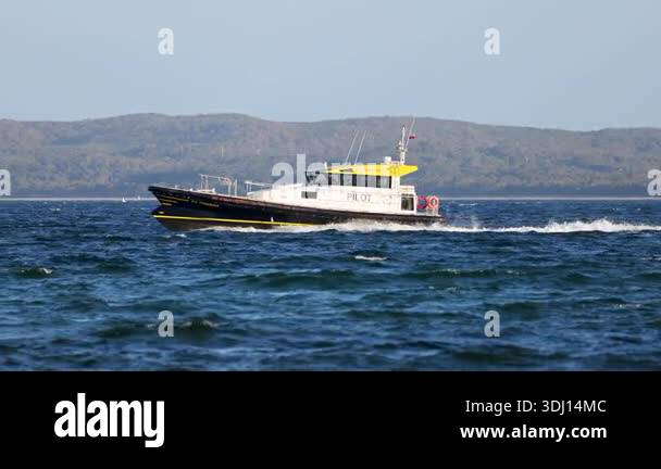A pilot boat speeds through the ocean near Bellarine, Victoria, under ...