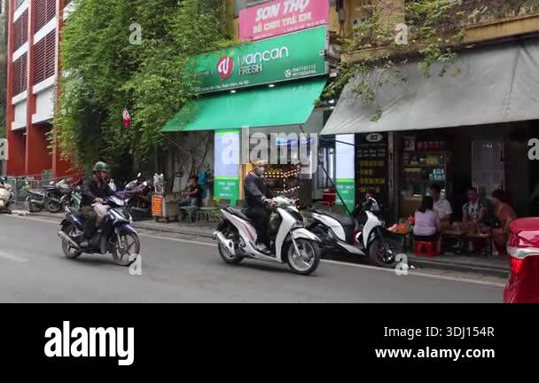Traffic and pedestrians on a busy city road Stock Video Footage - Alamy