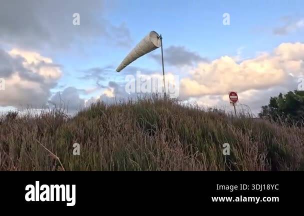 Windsock blowing in the wind, scenic view Stock Video Footage - Alamy