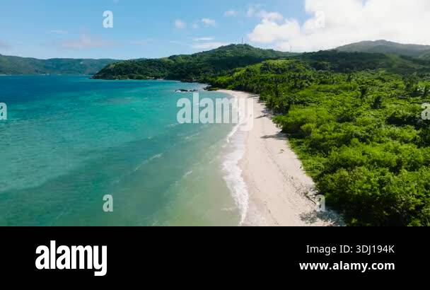Drone view of Bon Bon Beach with turquoise sea waves on sandy beach ...