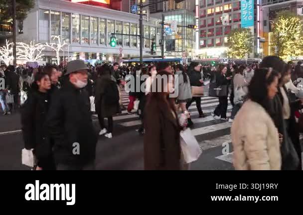 Tokyo, Japan- 16 Dec 2025: People to cross the Shibuya Scramble ...