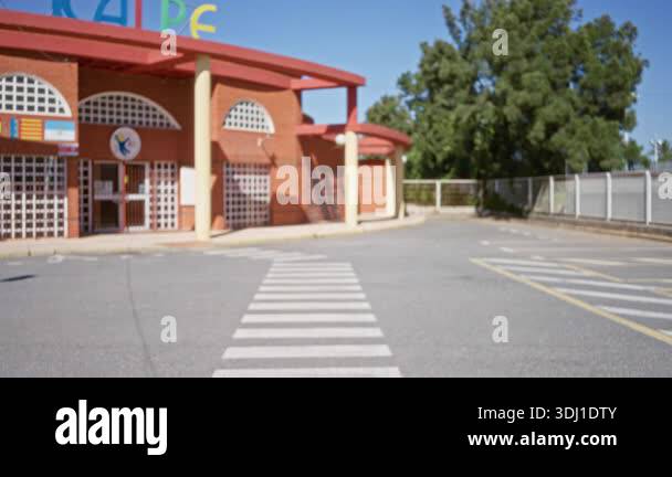 School entrance defocused background on building with soft bokeh facade ...
