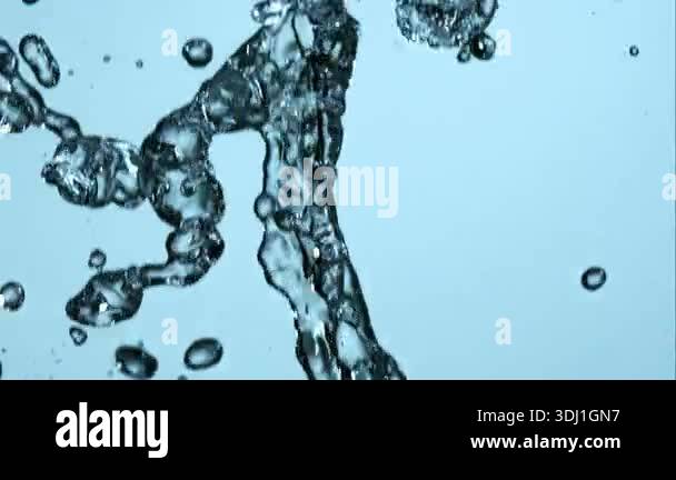 Dynamic slow motion shot of clean transparent water splashing and ...