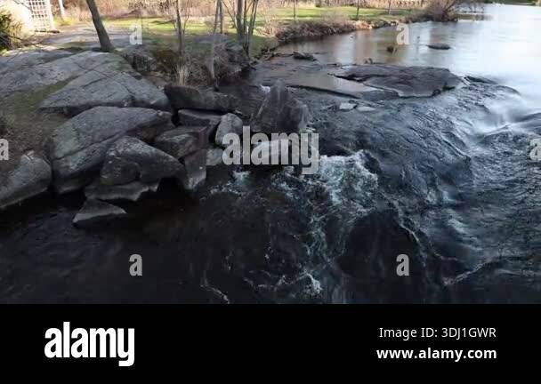City park with river flowing in spring. Stewart Park In Perth, Ontario ...