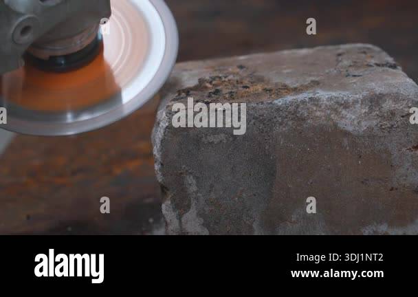 Close-up of industrial power tool angle grinder that grinds a rusty ...