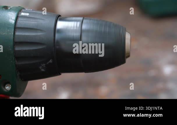 Extreme close-up of a rapidly rotating screwdriver chuck during ...