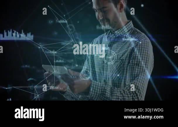 Tech pro entering dark studio tapping tablet creating network nodes ...