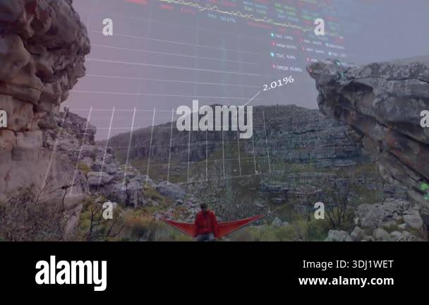 Data grid drifting over canyon rock urging man in red jacket swinging ...