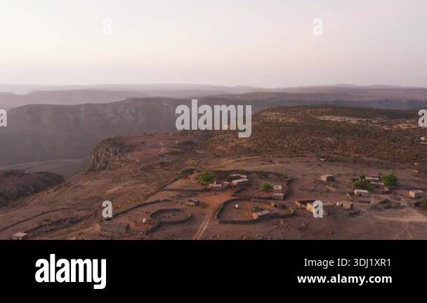 Aerial view of a remote village nestled in the mountains of Socotra ...