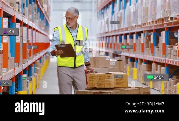 Warehouse inventory supervisor walking into aisle activating live data ...