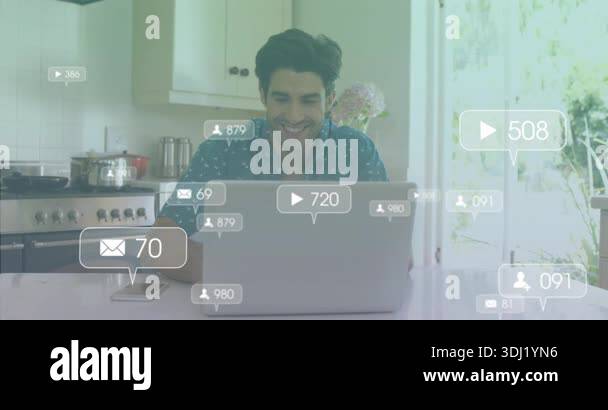 Man opening laptop at kitchen counter and tracking social media alerts ...