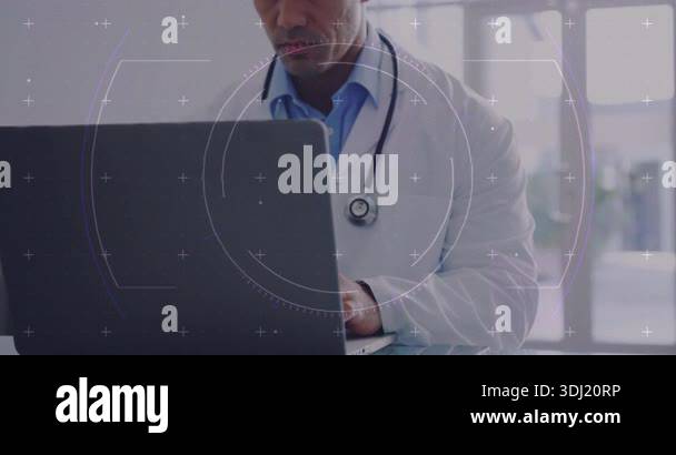 Doctor initiating typing on laptop and displaying animated HUD graphics ...