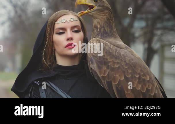creative shooting process with animals, fashion mdel posing with bird ...