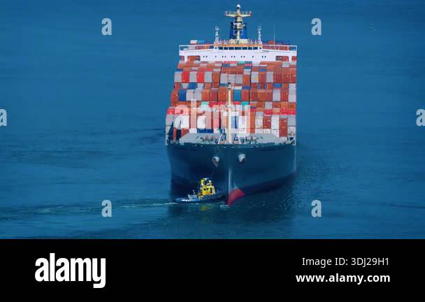 Tug boats push freighter ship Stock Videos & Footage - HD and 4K Video ...