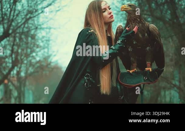 creative shooting process with animals, fashion mdel posing with bird ...