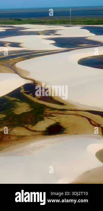 Sand dunes mountains and rain water lagoons at northeast brazilian paradise. World travel ...
