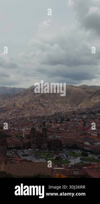 High-angle view overlooking Cusco, Peru. Shows red-tiled roofs, the ...