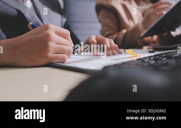 Auditor and accountant team working in office, analyze financial data ...