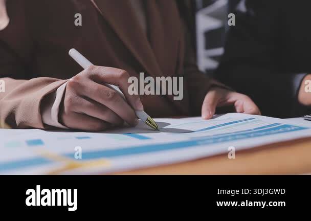 Auditor and accountant team working in office, analyze financial data ...