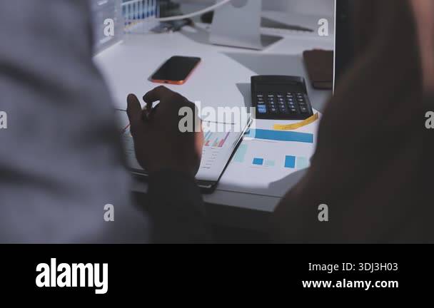 Auditor and accountant team working in office, analyze financial data ...