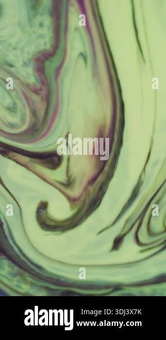 Vertical video. Ink spilling. Color flow. Blur yellow purple blue ...