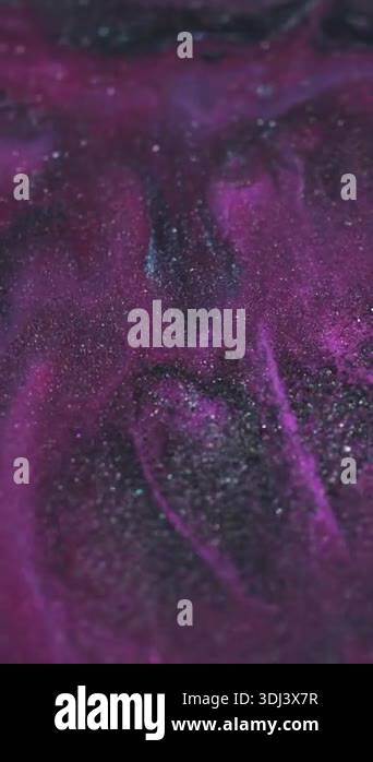 Vertical video. Shiny paint spill. Glitter fluid wave. Defocused purple ...
