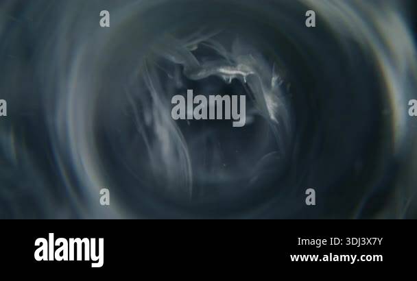 Defocused steam flow. Paint vapor drop. Gray silver pigment spill in ...